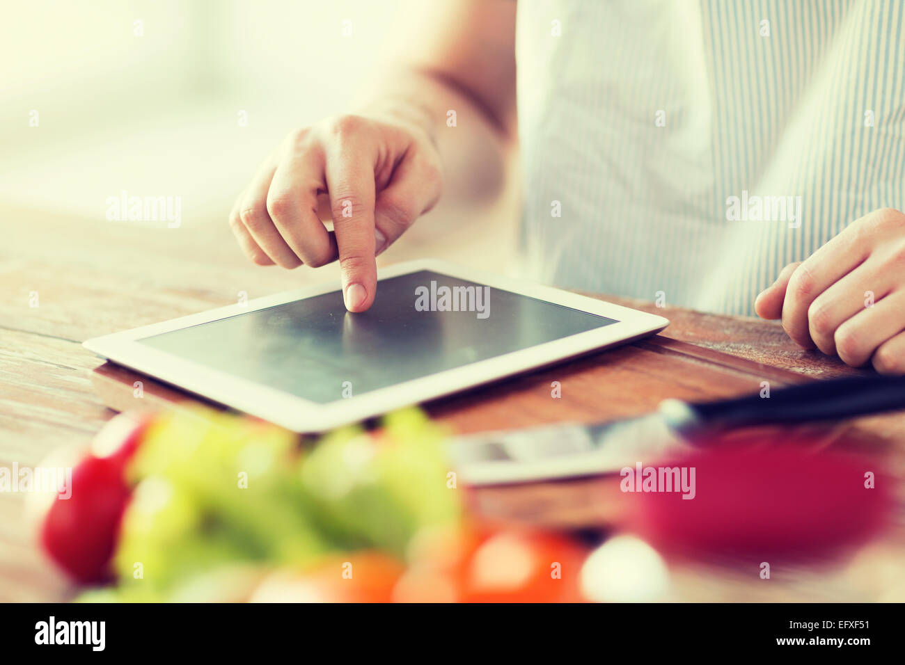 closeup of man pointing finger to tablet pc Stock Photo - Alamy