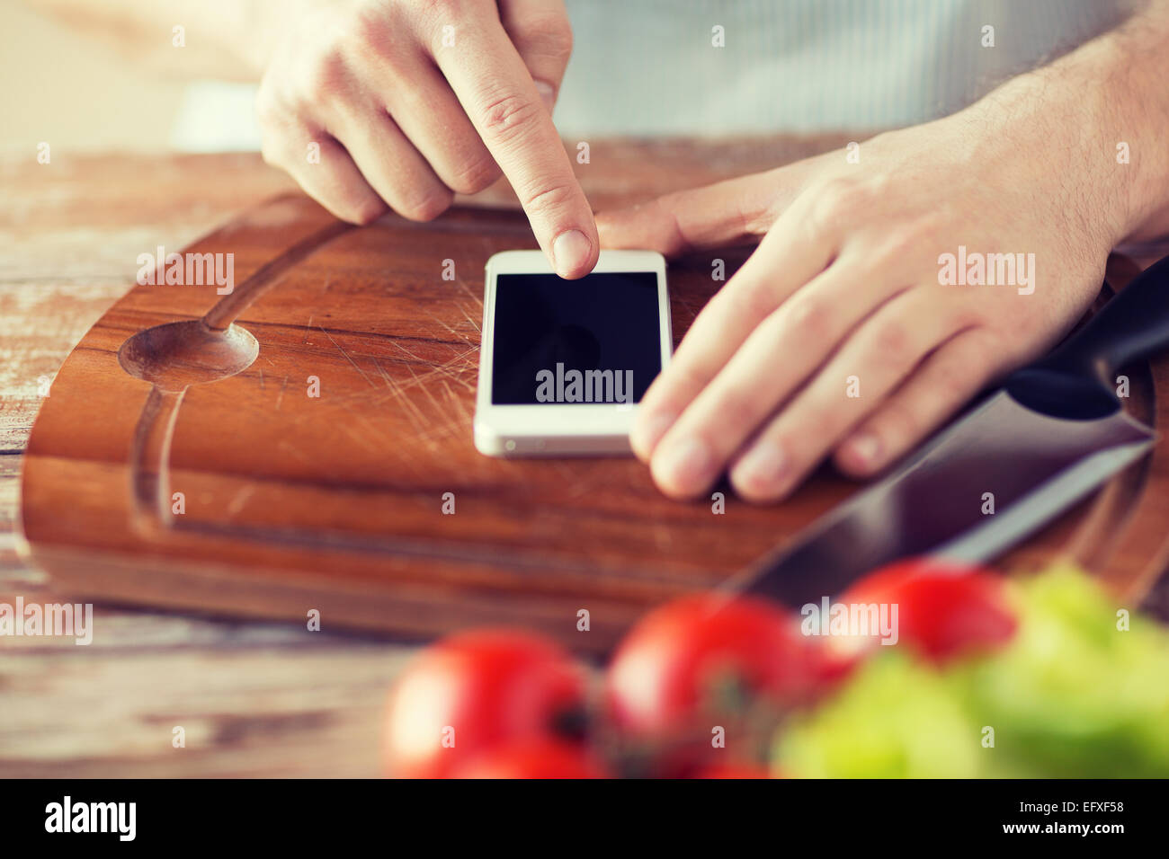 closeup of man pointing finger to smartphone Stock Photo - Alamy