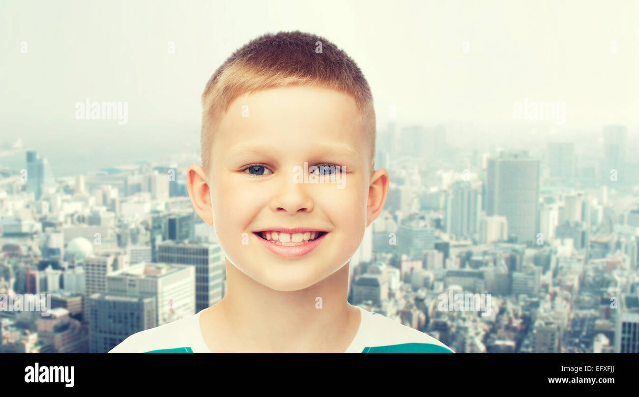 smiling little boy over green background Stock Photo - Alamy