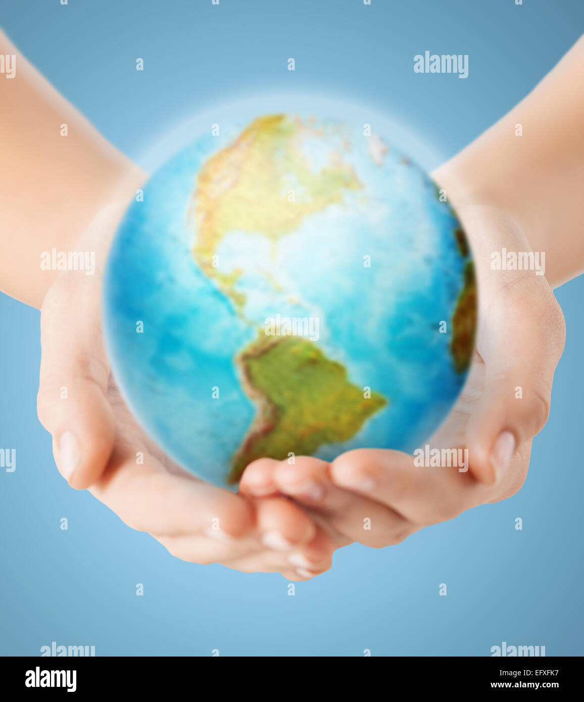 Hands holding up globe hi-res stock photography and images - Alamy