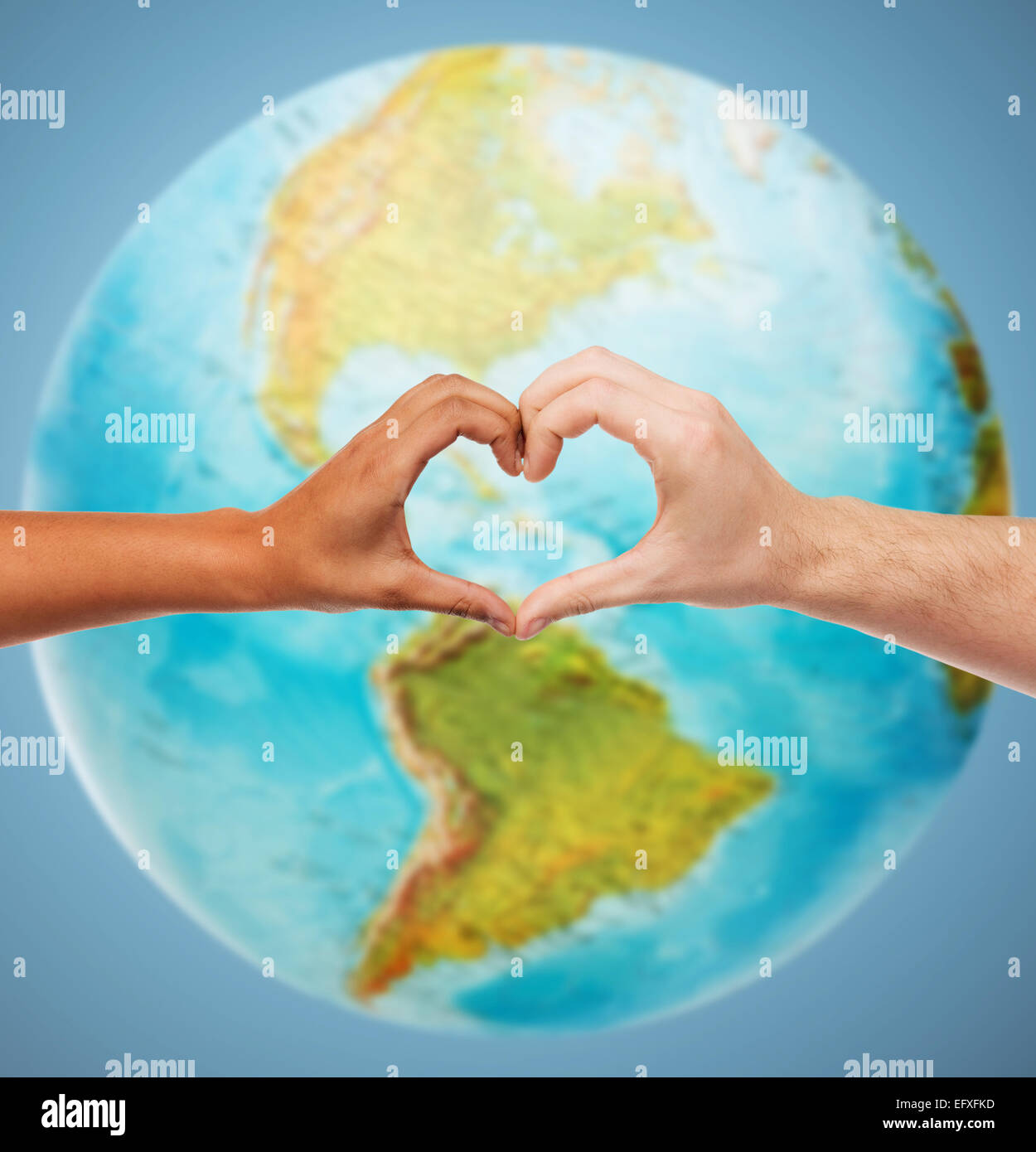 human hands showing heart shape over earth globe Stock Photo - Alamy