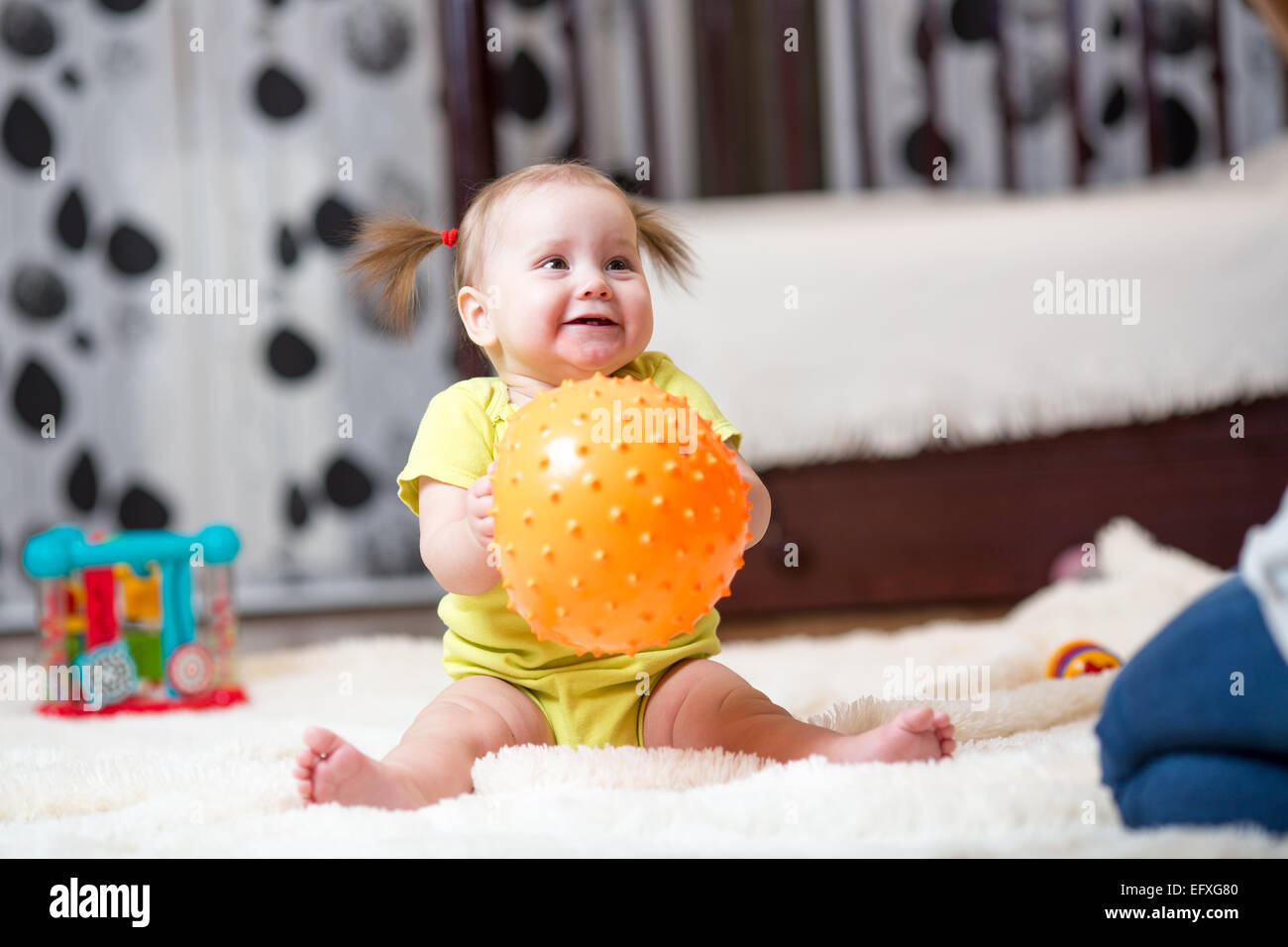 Toddler playing ball hi-res stock photography and images - Alamy
