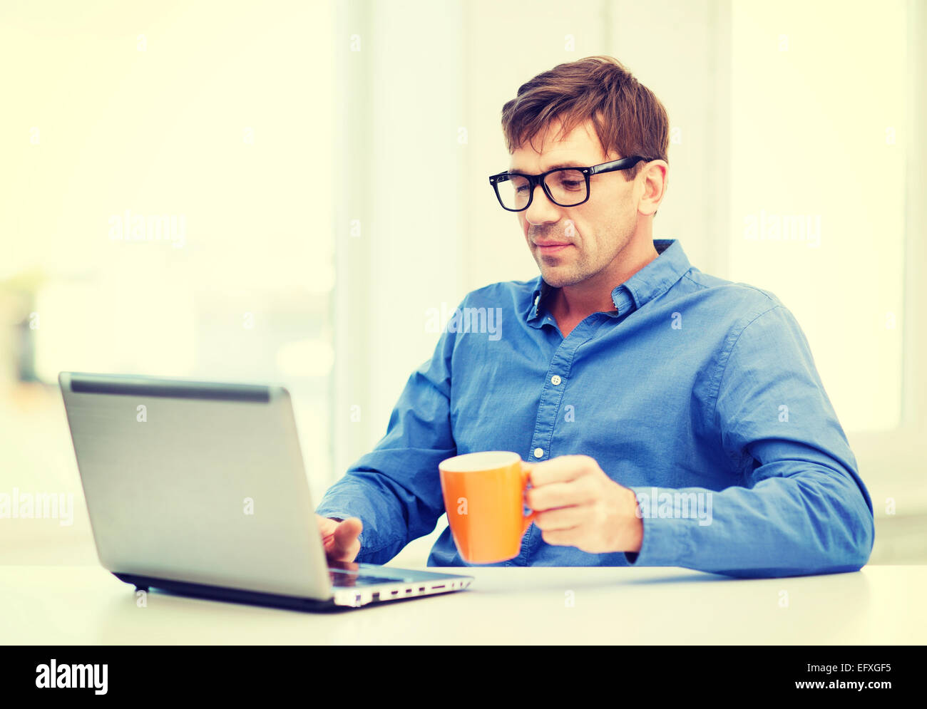 man working with laptop at home Stock Photo - Alamy