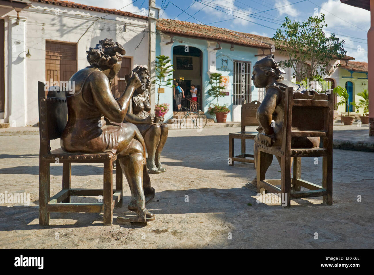 Horizontal close up of lifelike comical bronze statues in Camaguey ...