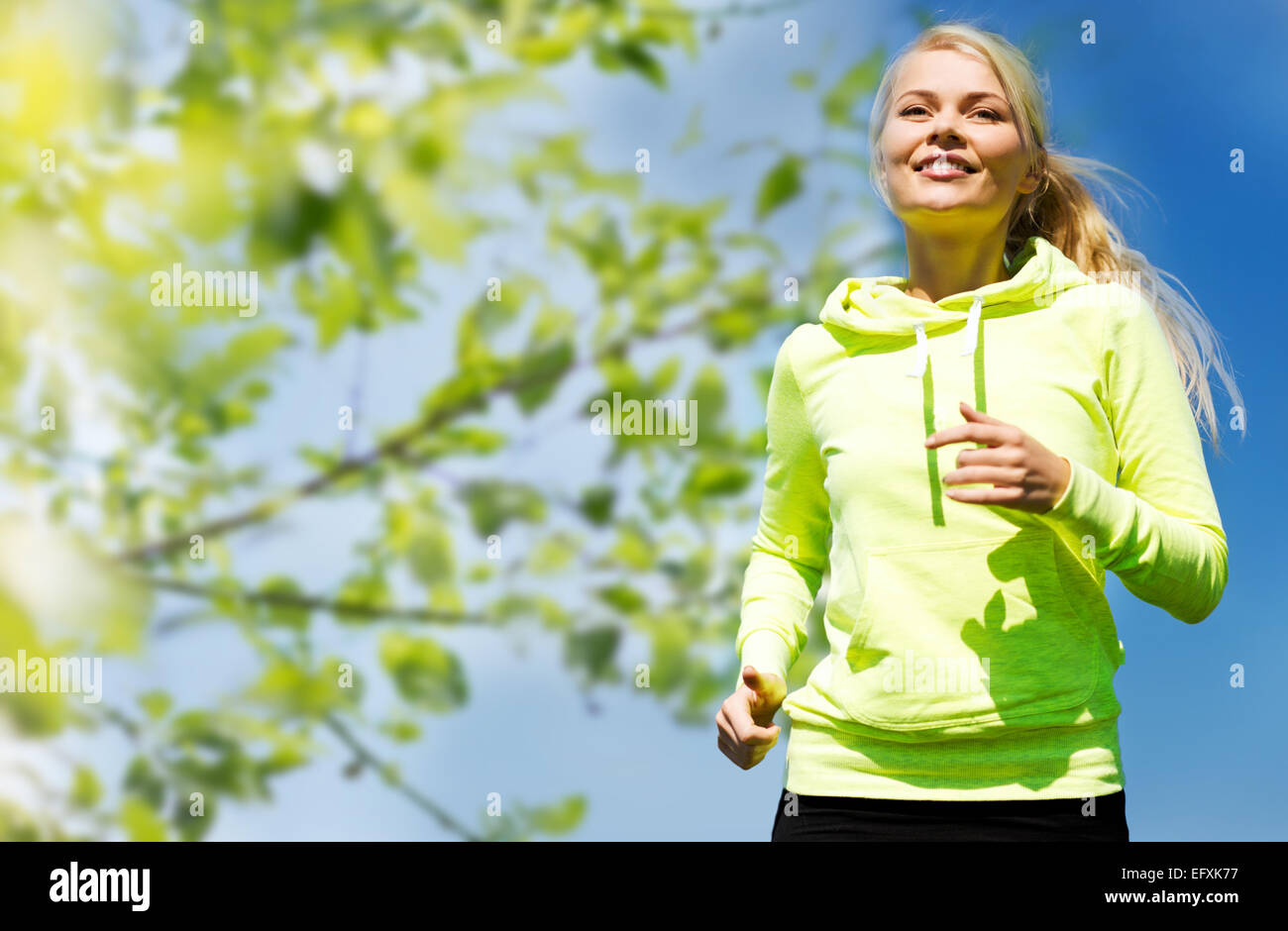 woman jogging outdoors Stock Photo - Alamy