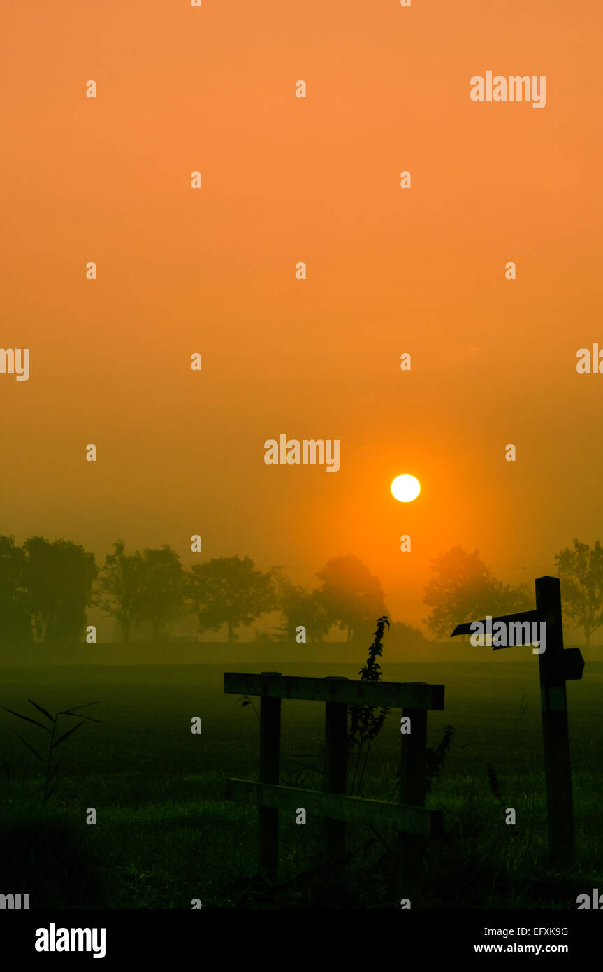 A broken sign post on a misty morning Stock Photo - Alamy