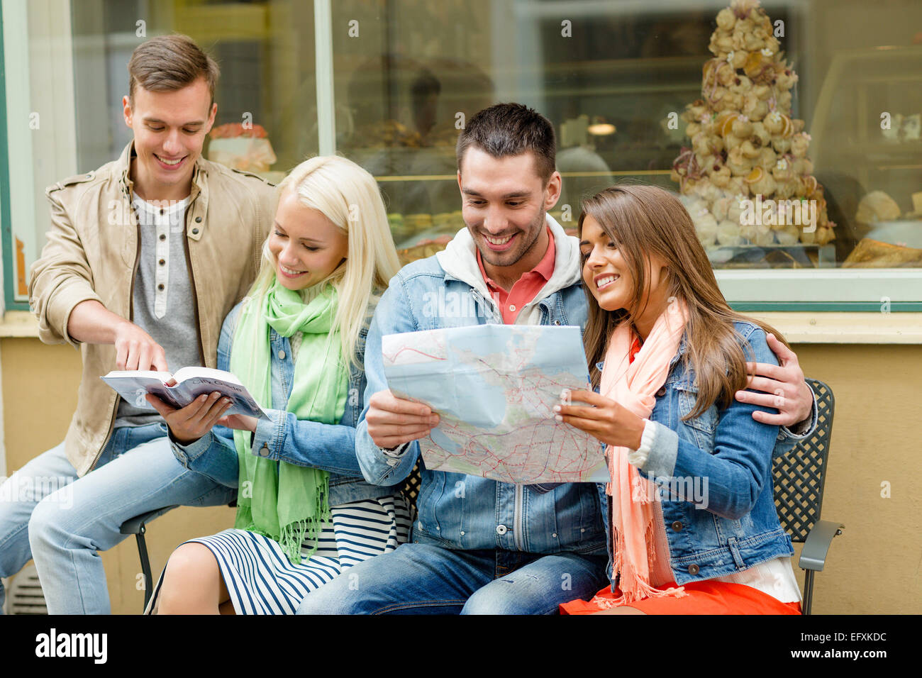 group of friends with guide and map exploring town Stock Photo - Alamy
