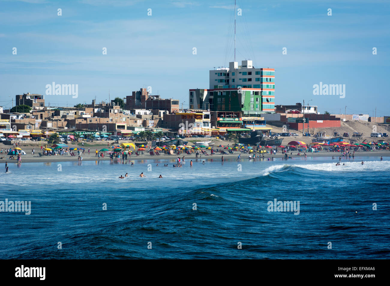 View of Pimentel Beach in Chiclayo northern Peru with waves, people ...