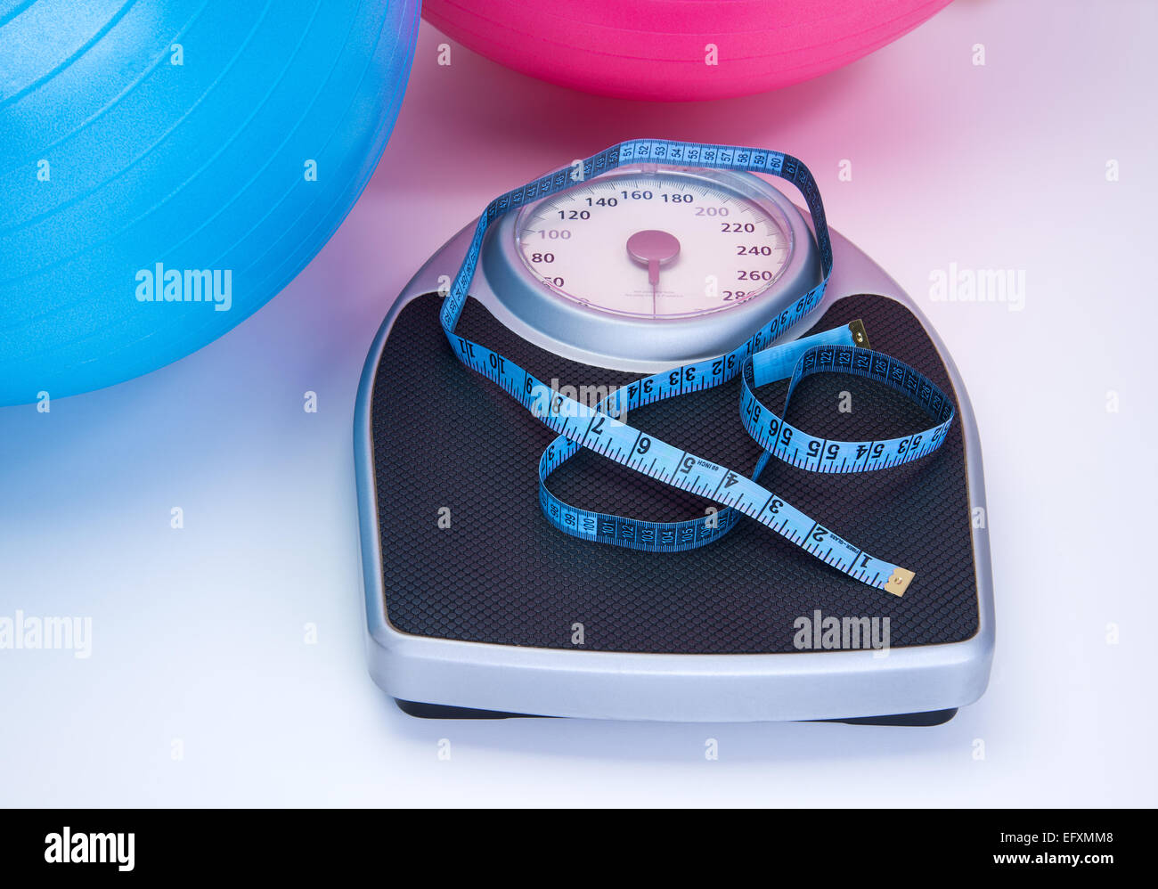 Weight scale and fitness workout gear Stock Photo - Alamy