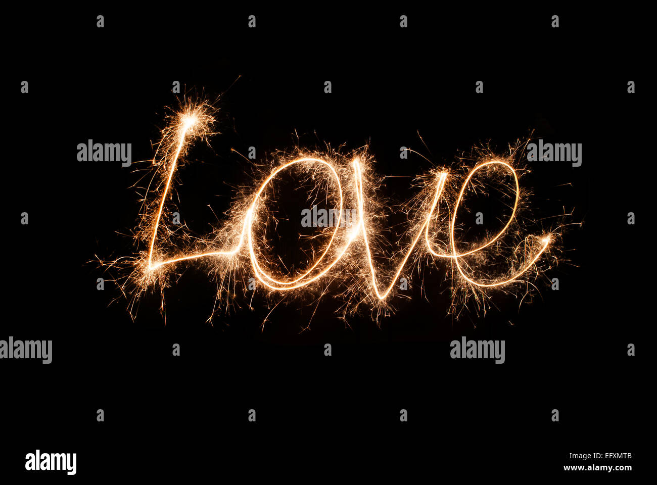 The inscription "Love" from sparklers Stock Photo - Alamy