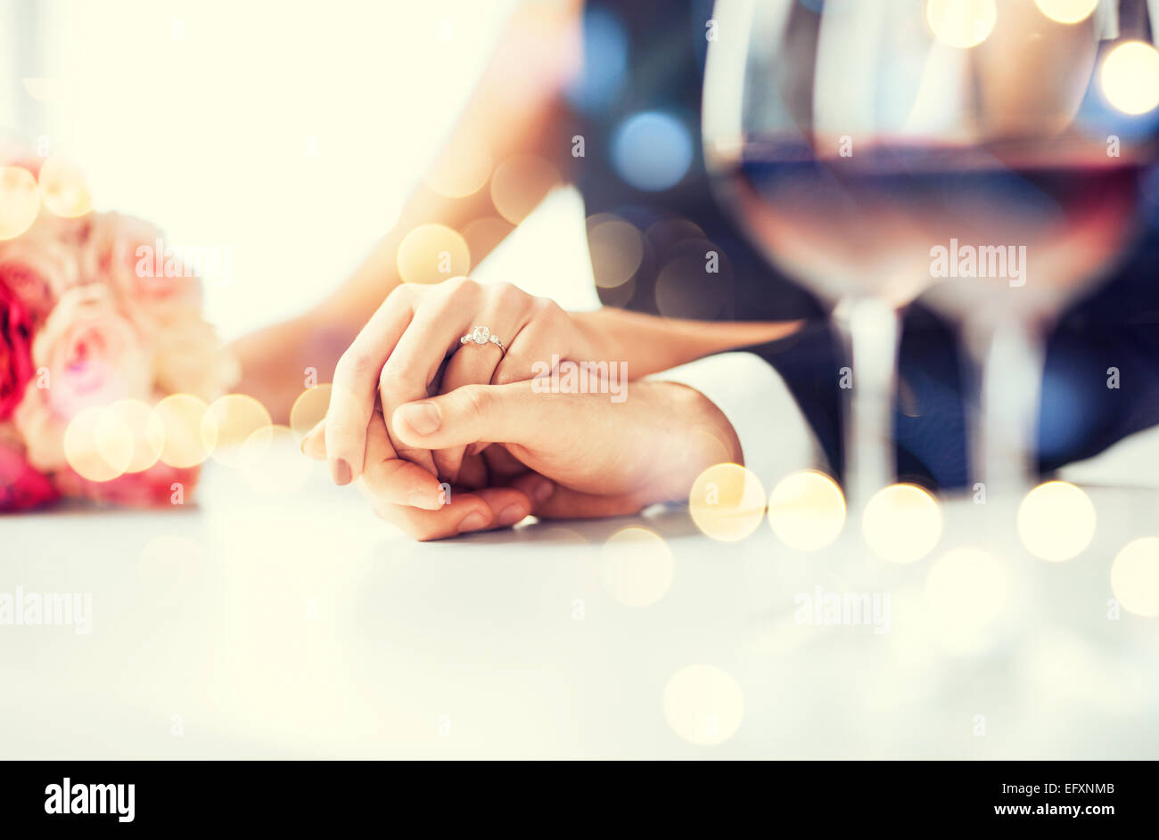 engaged couple with wine glasses Stock Photo - Alamy