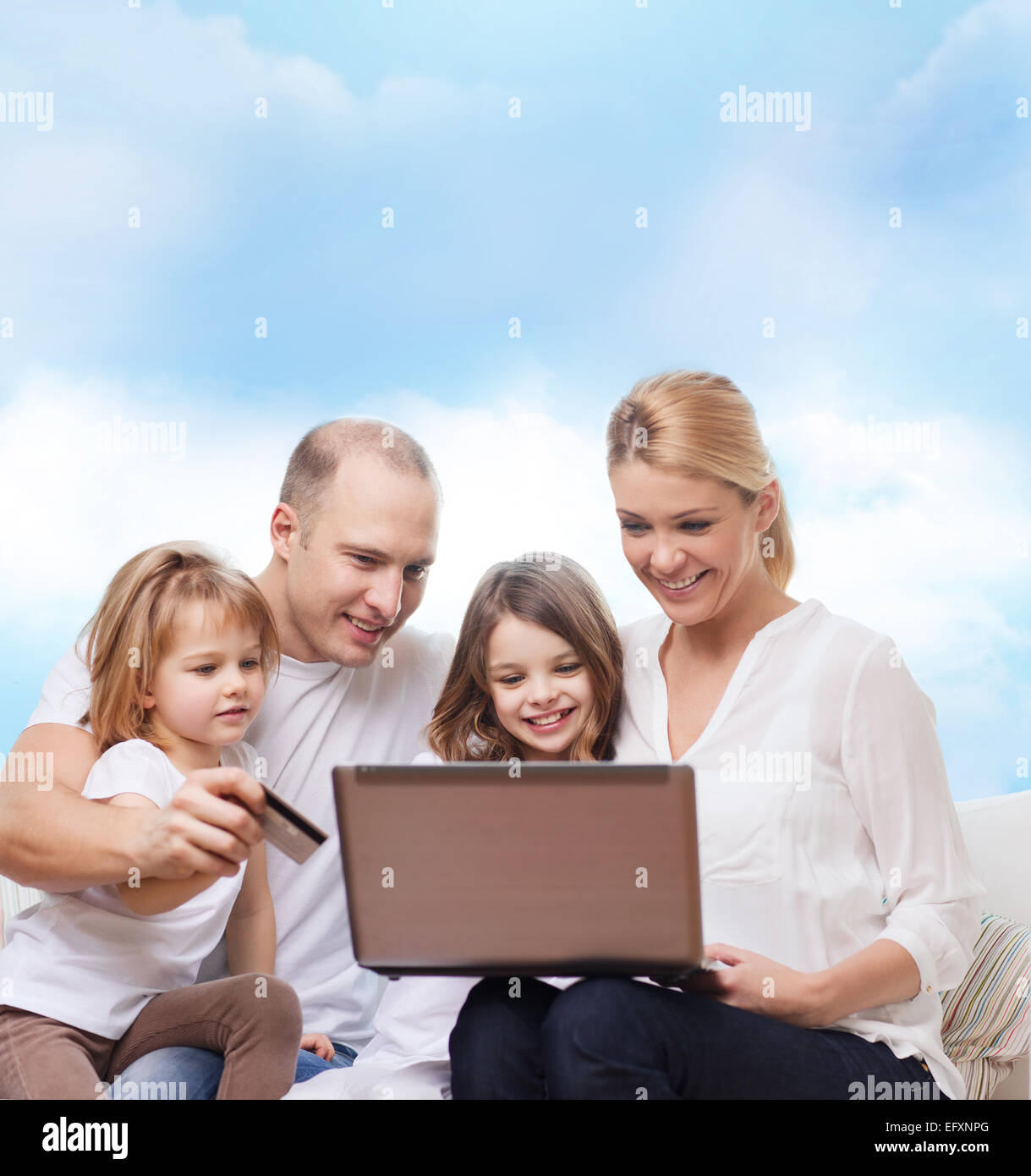 happy family with laptop computer and credit card Stock Photo - Alamy