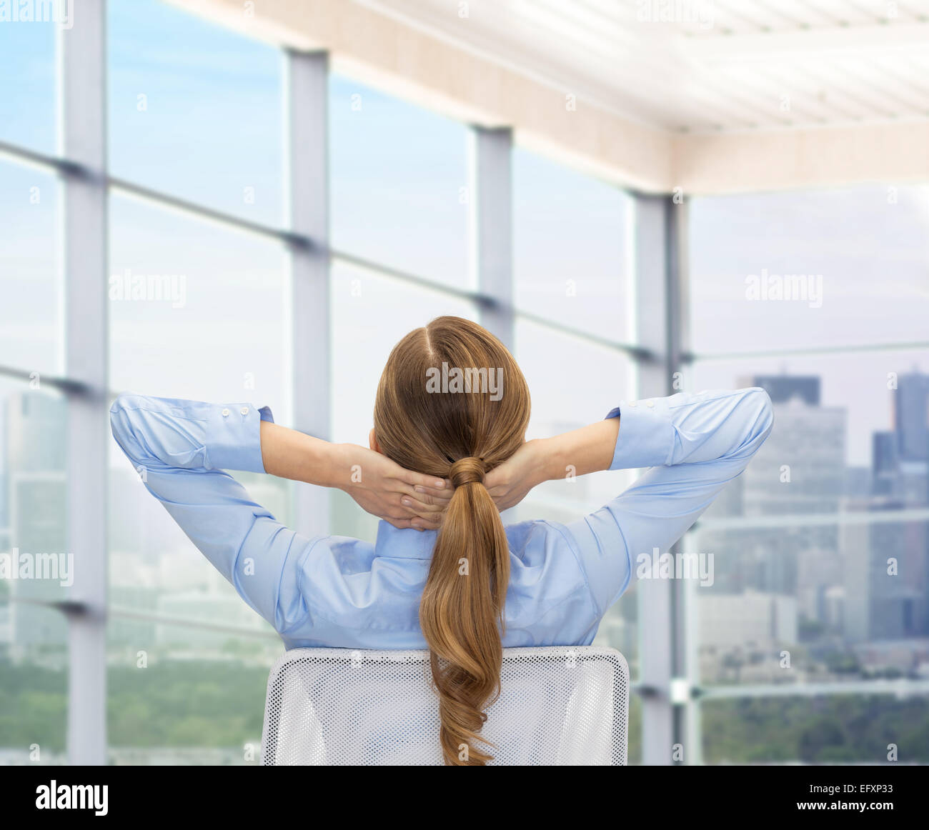 businesswoman sitting on chair from back Stock Photo - Alamy