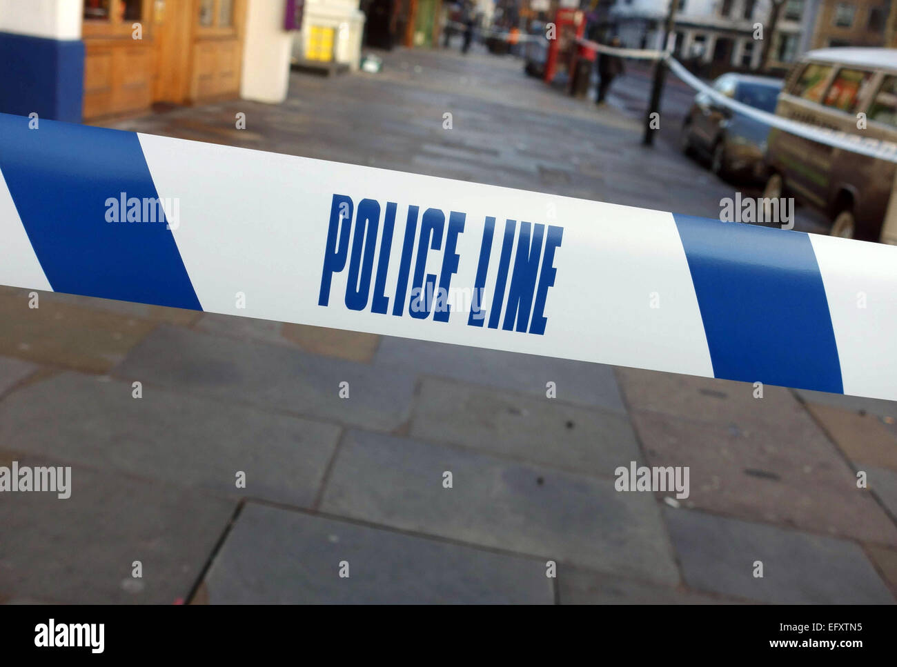 Crime scene in London street taped off by investigating police Stock ...