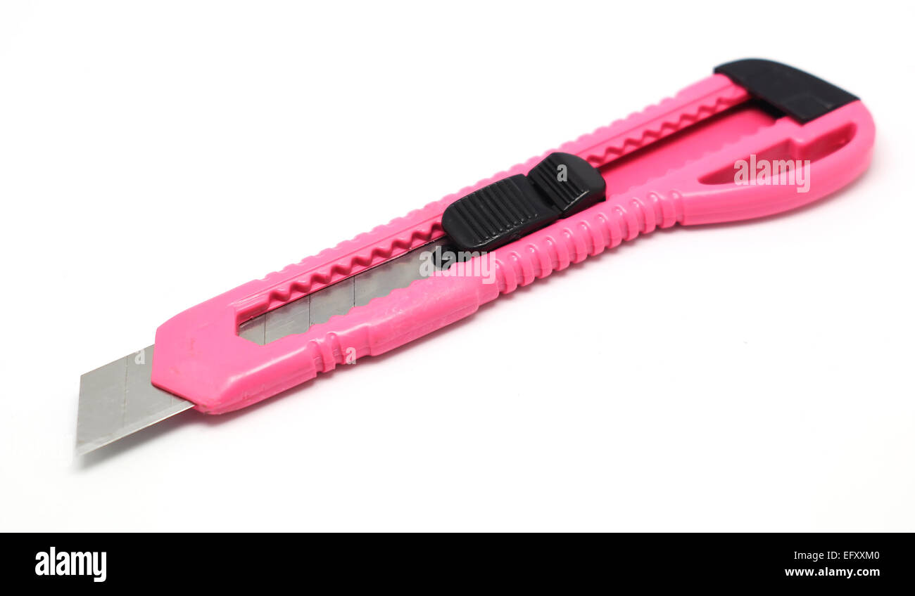 pink stationery knife or boxcutter isolated on white background Stock ...