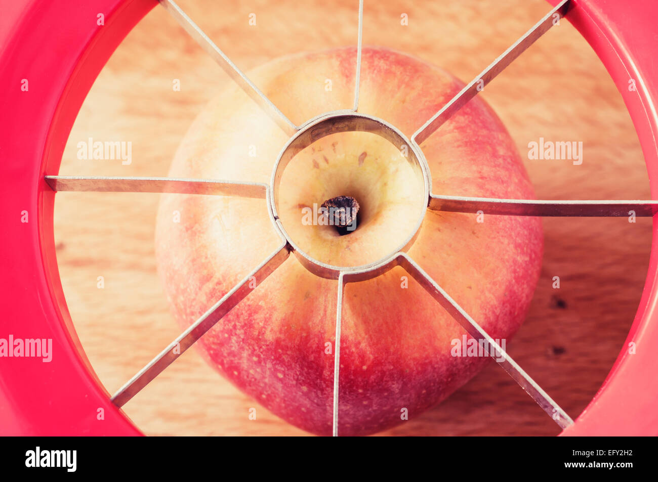 Apple cut into slices and core Stock Photo - Alamy
