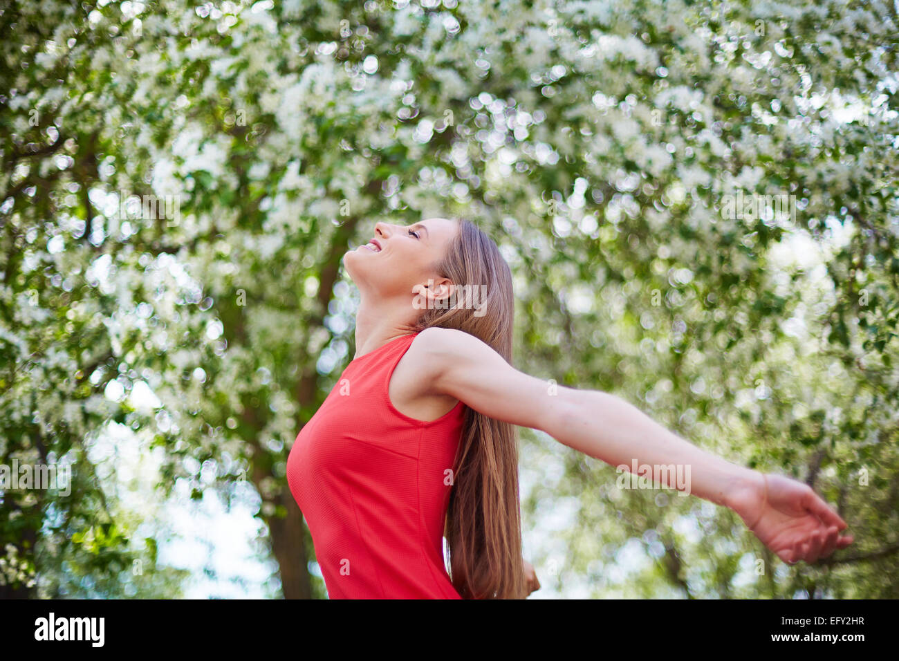Ecstatic girl taking pleasure in summer day Stock Photo - Alamy