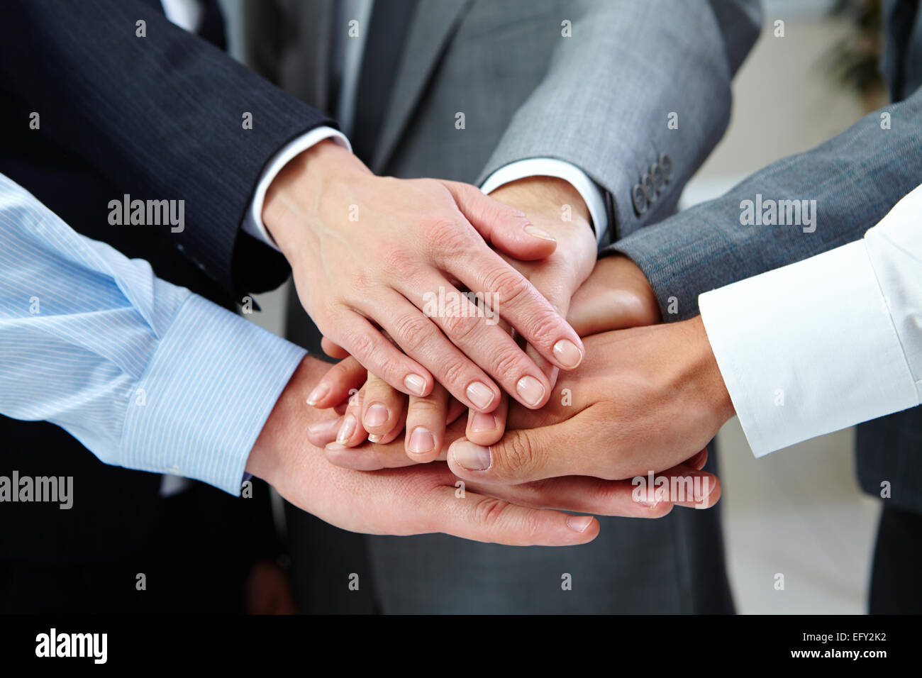 Business people hands on top of each other Stock Photo - Alamy