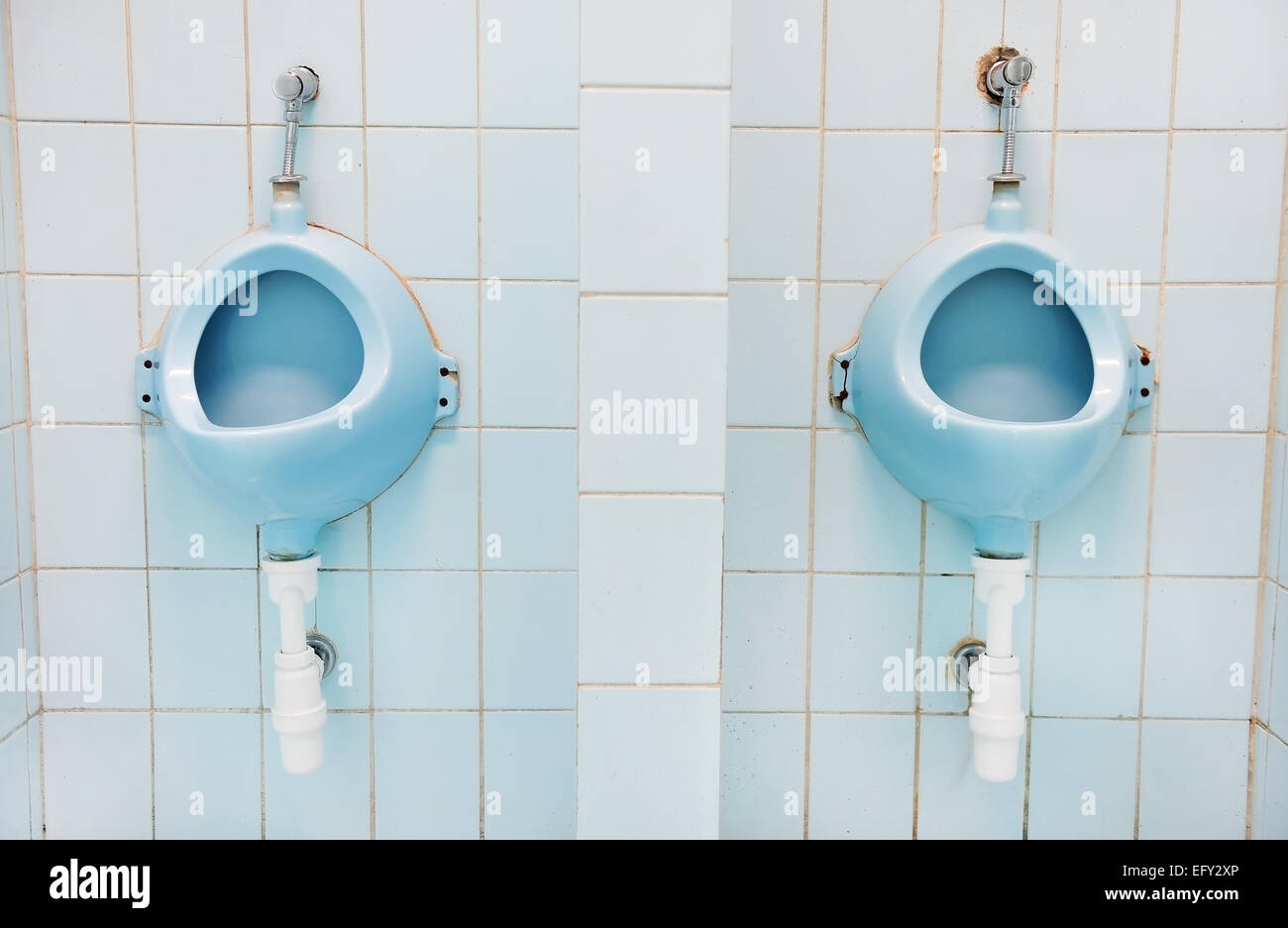 Detail with two blue urinals in a public men's toilet Stock Photo - Alamy