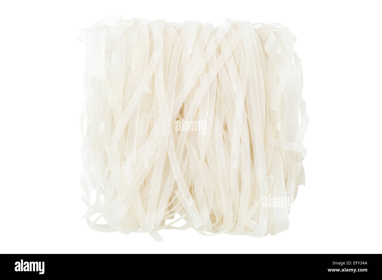Closeup of block of dried rice noodles, isolated on white background ...