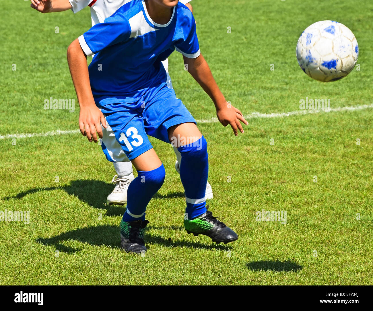 Kid soccer players in action Stock Photo - Alamy