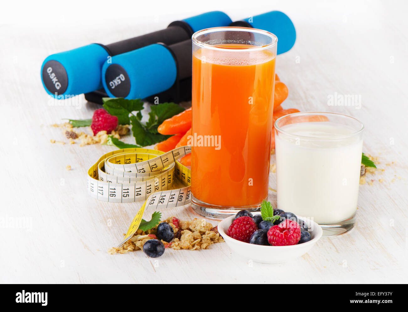 dumbbells with healthy food - health and diet concept. Selective focus ...