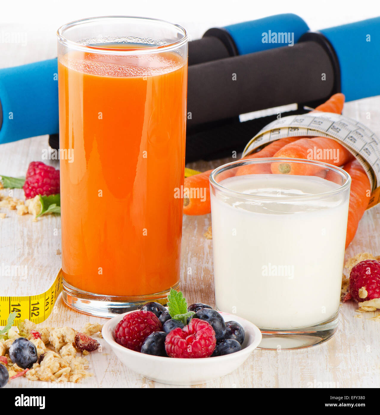 dumbbells with healthy food - health and diet concept. Selective focus ...