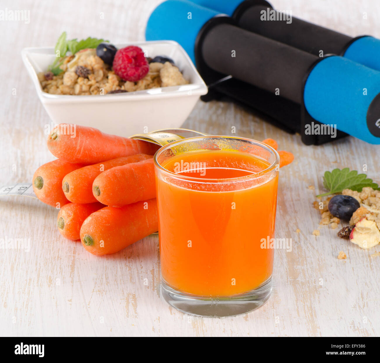 dumbbells with healthy food and drink - health and diet concept ...