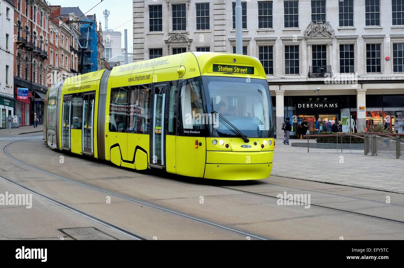 yellow painted Tram in the old market square Nottingham city centre ...