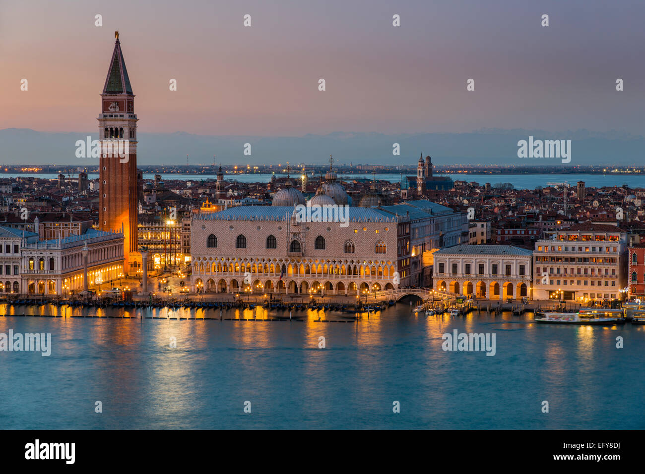 Top view of St. Mark’s Campanile and Doge’s Palace with Alps behind at ...