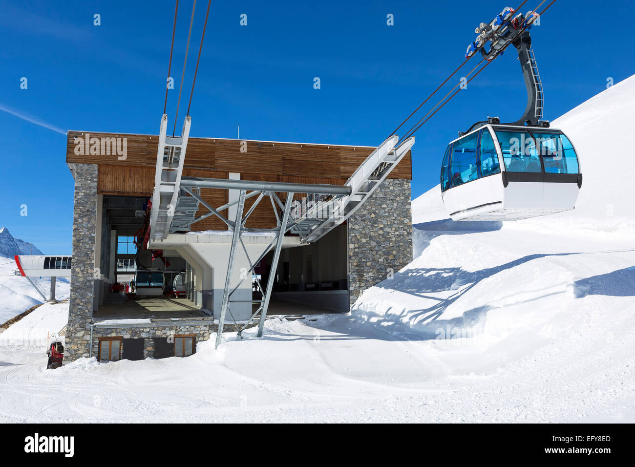 A cable way with cable cars in a mountain area Stock Photo - Alamy