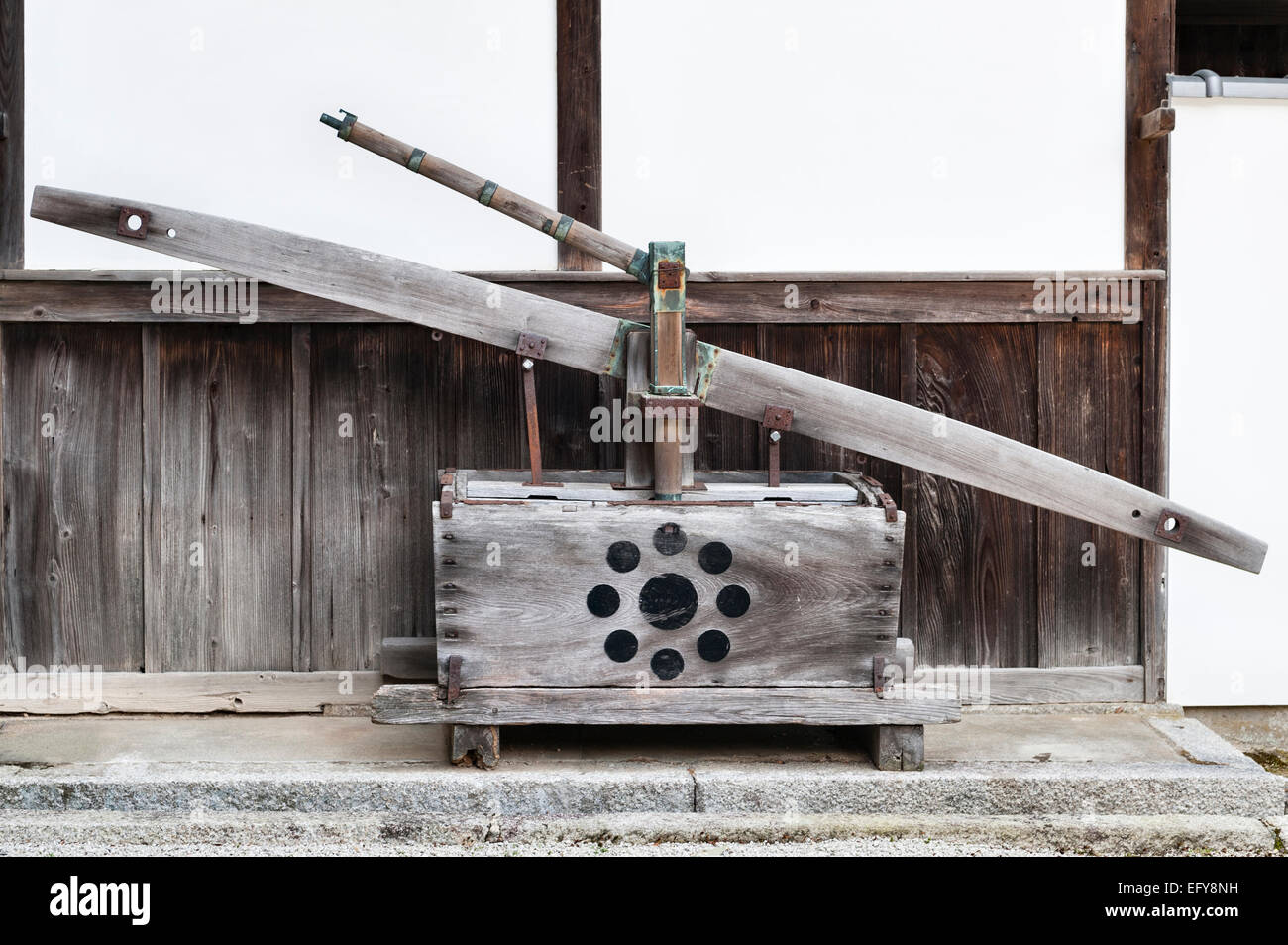 Kyoto, Japan. An old wooden fire engine (pump) with a bamboo nozzle at ...