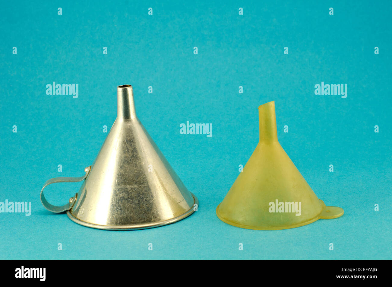 retro metal and plastic funnel hopper tool on blue background Stock ...