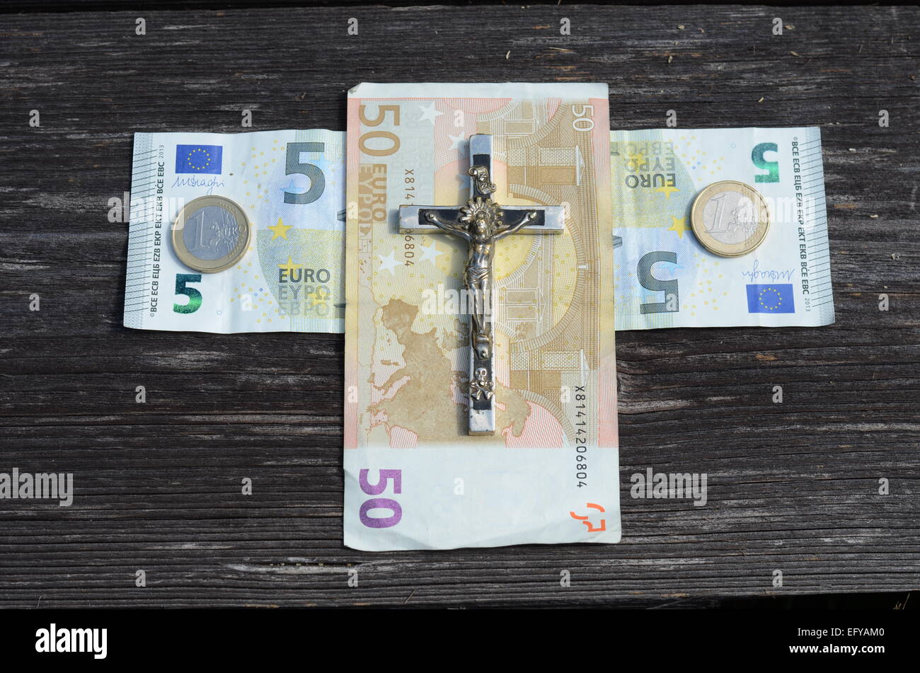 euro money cross and metal crucifixion with Jesus concept Stock Photo ...