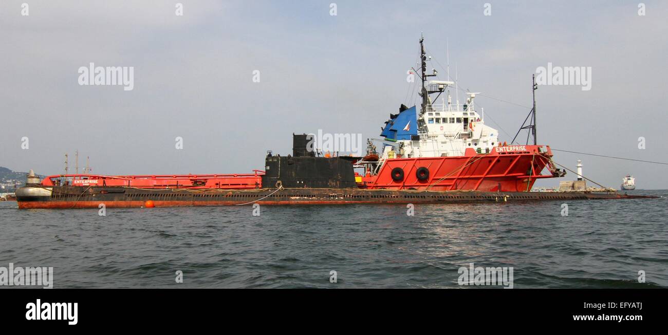 A tugboat pulls a Russian-made Bulgarian submarine, the Nadezhda (Hope ...