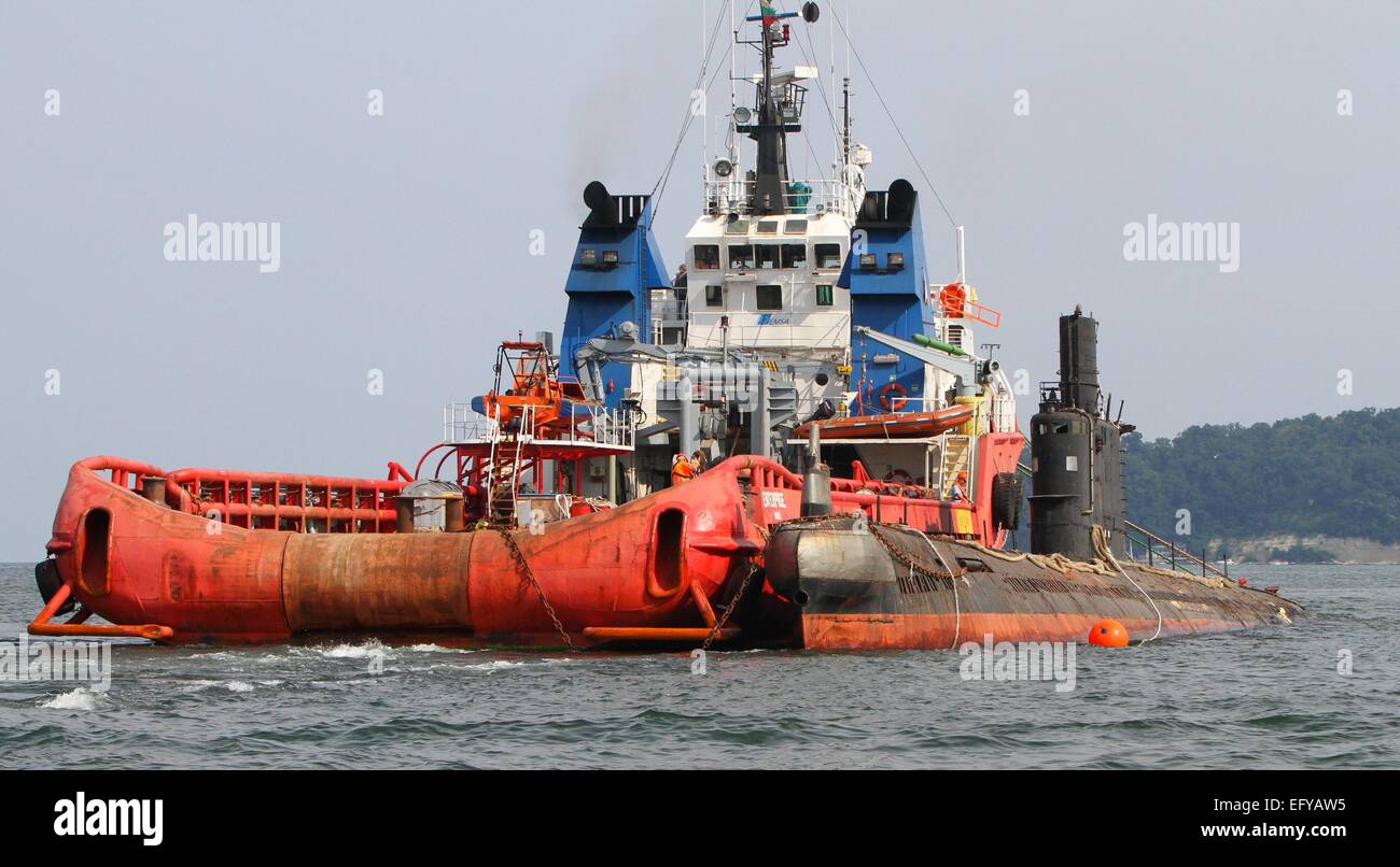 A tugboat pulls a Russian-made Bulgarian submarine, the Nadezhda (Hope ...