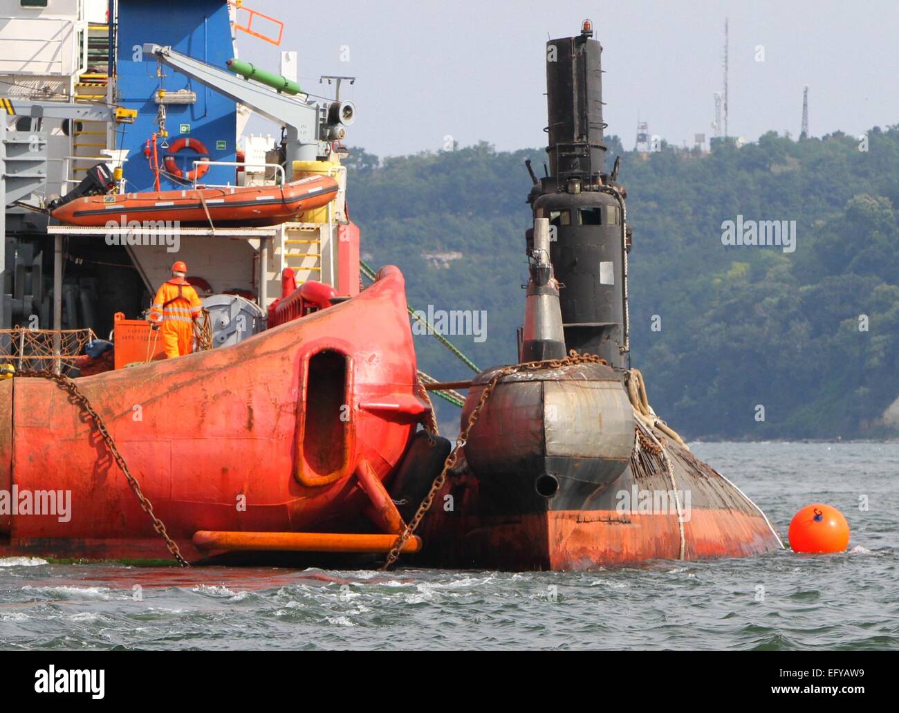A tugboat pulls a Russian-made Bulgarian submarine, the Nadezhda (Hope ...