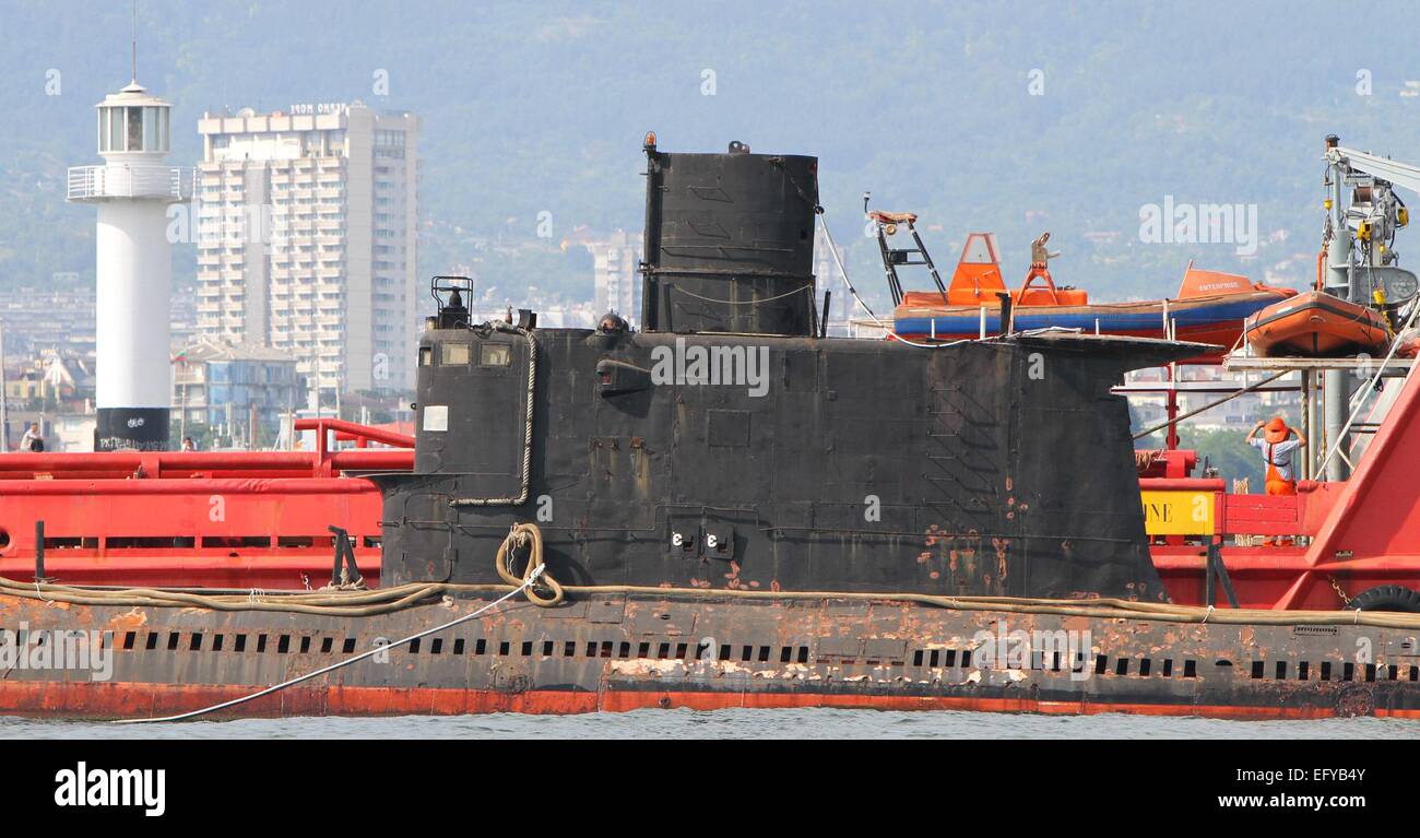 A tugboat pulls a Russian-made Bulgarian submarine, the Nadezhda (Hope ...