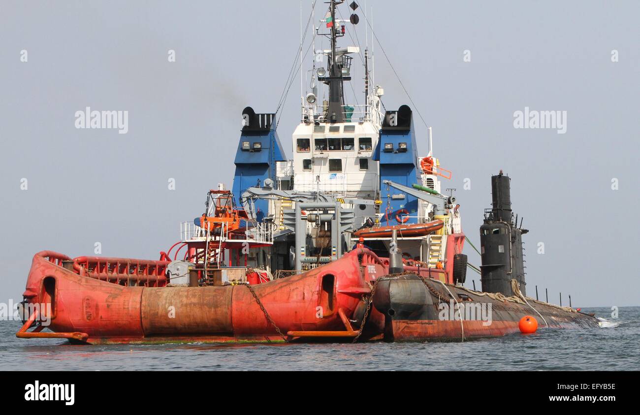 A tugboat pulls a Russian-made Bulgarian submarine, the Nadezhda (Hope ...