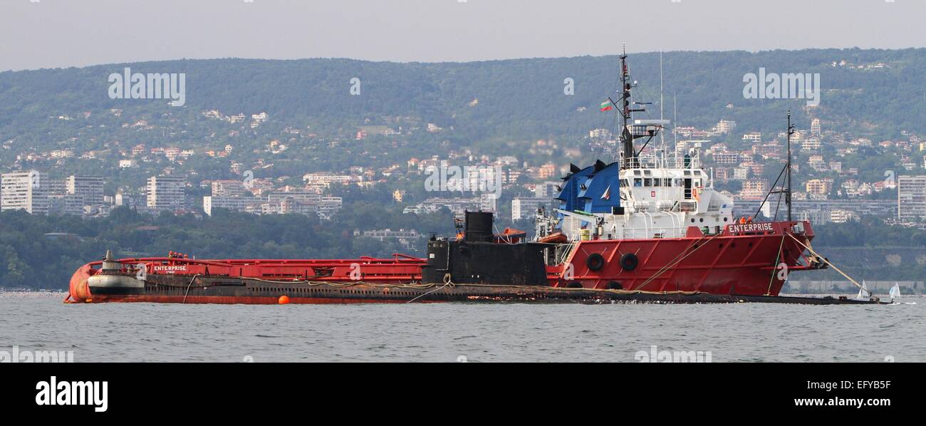 A tugboat pulls a Russian-made Bulgarian submarine, the Nadezhda (Hope ...