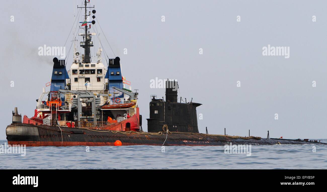 A tugboat pulls a Russian-made Bulgarian submarine, the Nadezhda (Hope ...