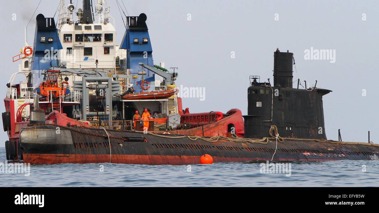 A tugboat pulls a Russian-made Bulgarian submarine, the Nadezhda (Hope ...