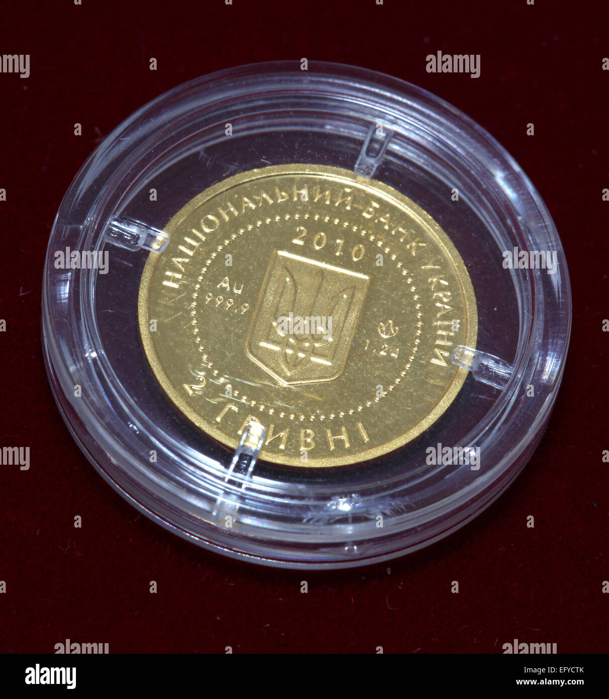 Gold coin in a glass box Stock Photo - Alamy