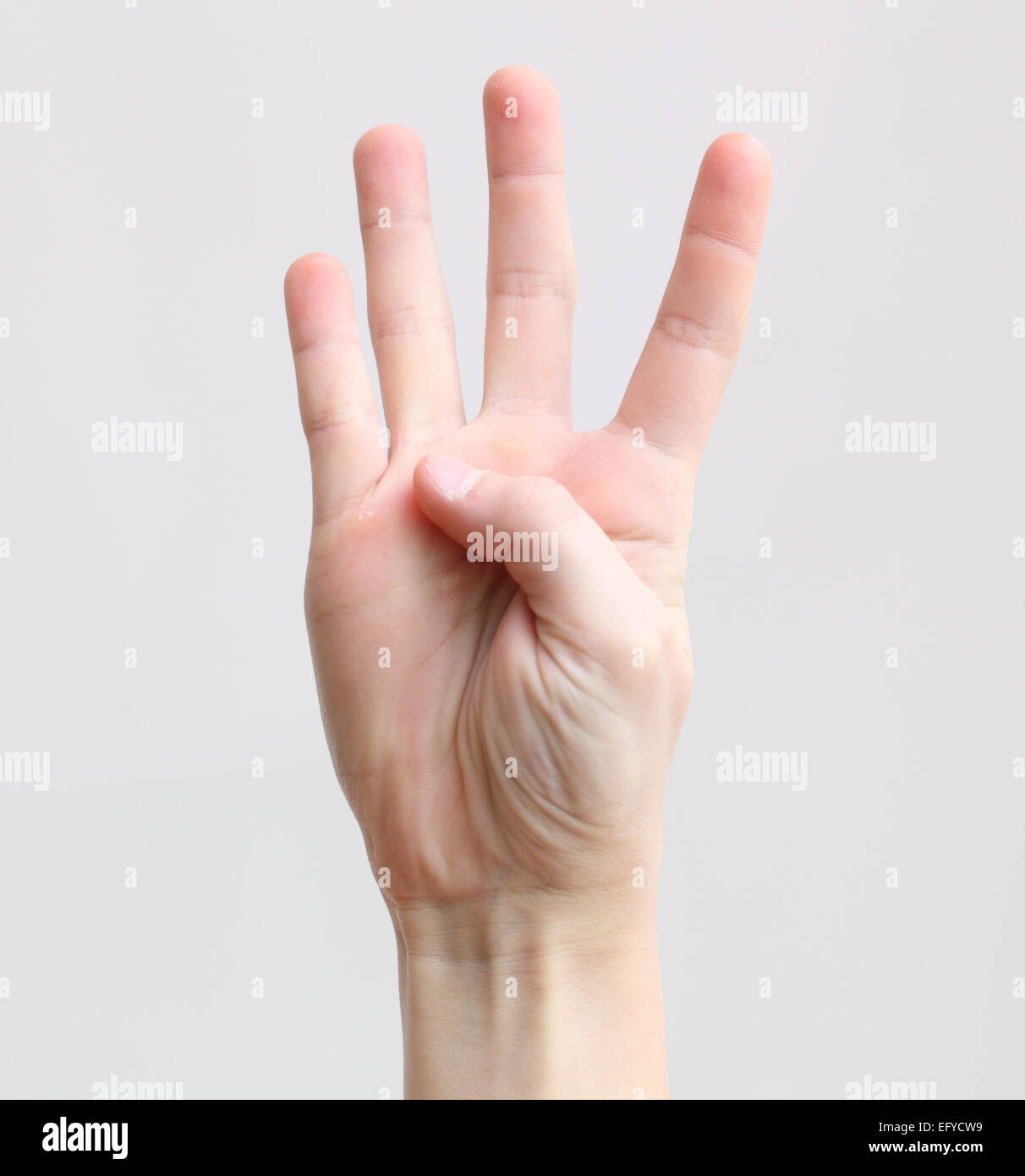 four fingers of the hand on a gray background Stock Photo - Alamy