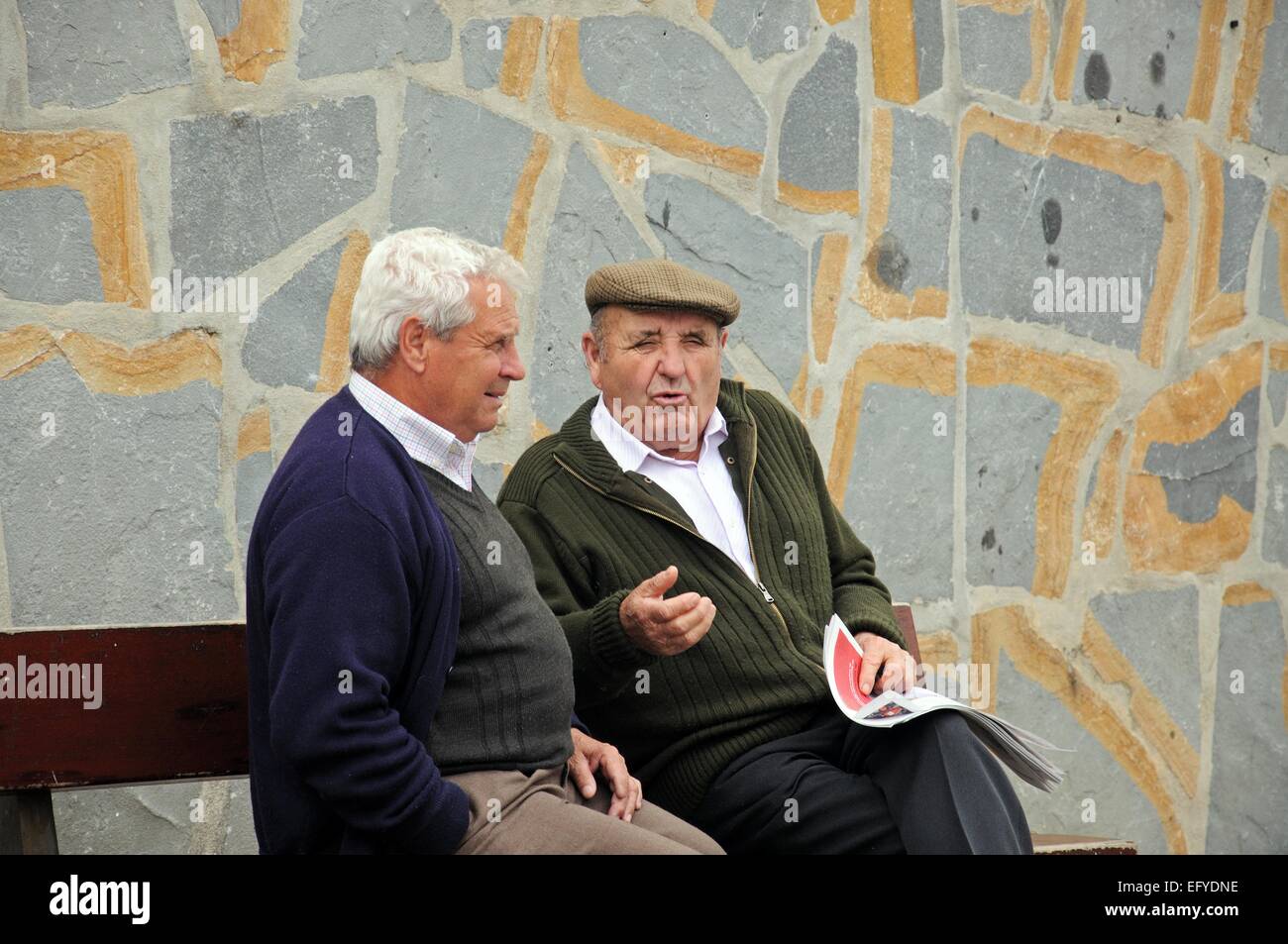 Two old Spanish men sitting on a bench chatting, Casares, Cadiz ...
