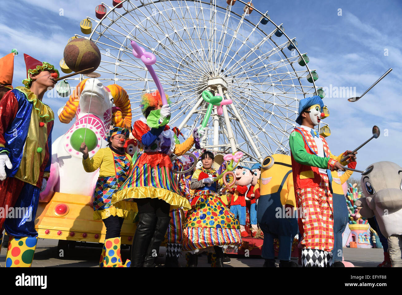 Beijing, China. 12th Feb, 2015. Clowns perform during a float parade ...