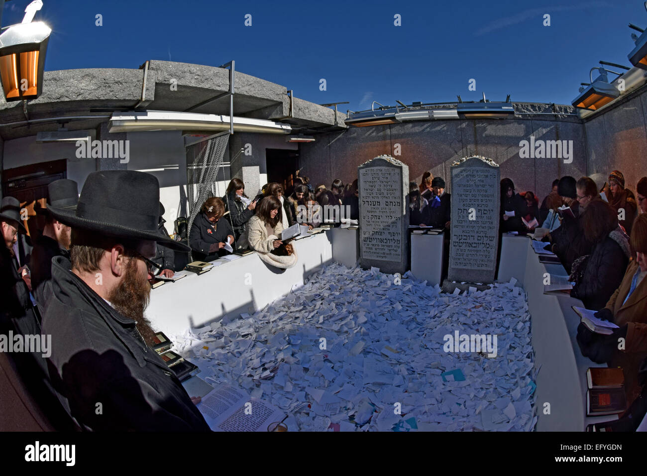 Religious Jews praying at the Ohel at the graves of the 6th & 7th ...