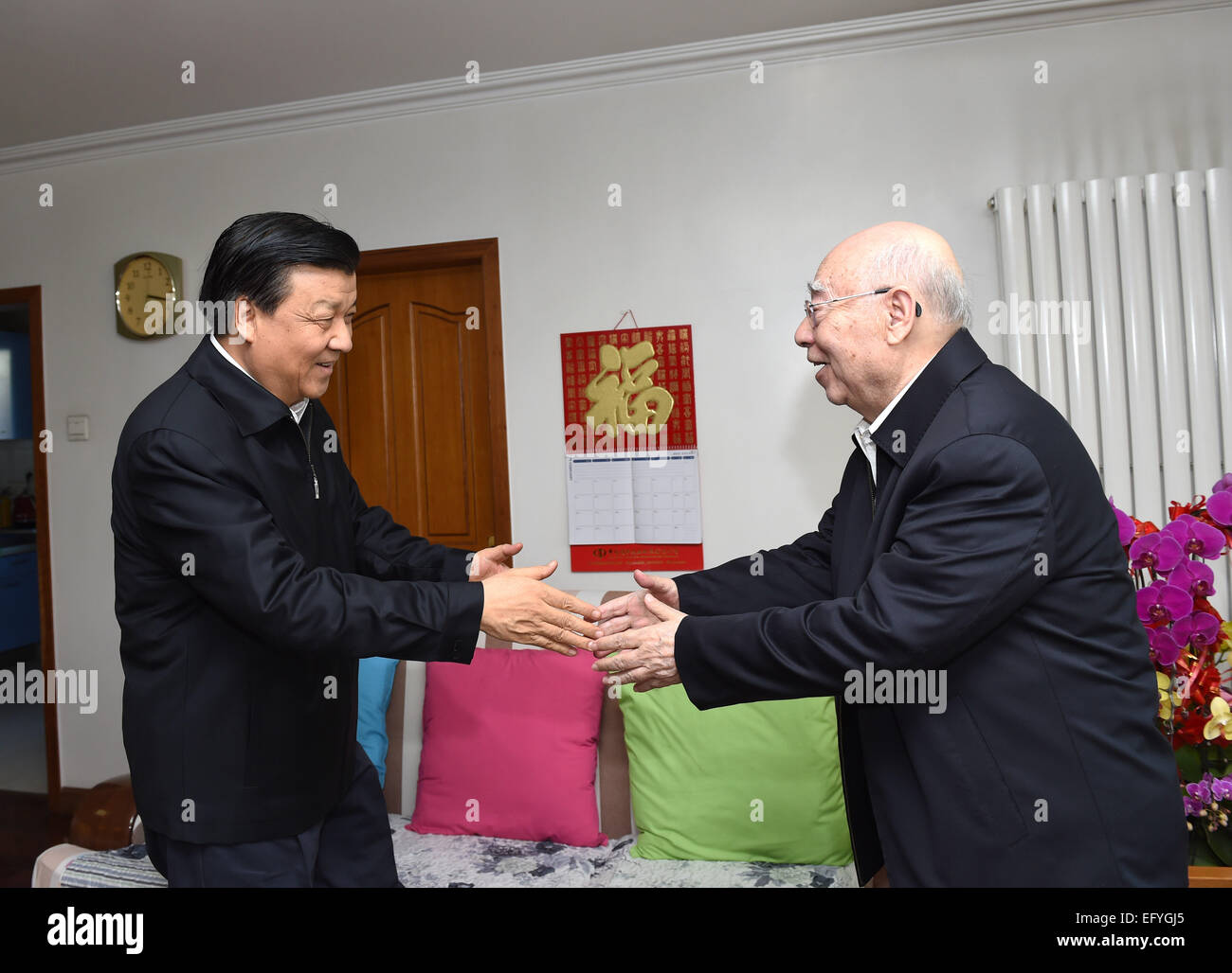 Beijing, China. 11th Feb, 2015. Liu Yunshan (L), a member of the ...