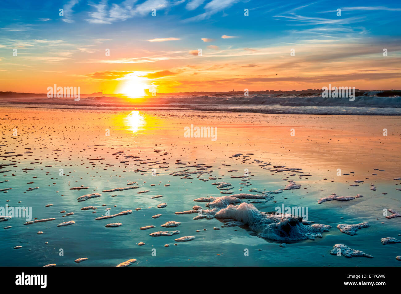 Beautiful orange sunset at the beach Stock Photo - Alamy