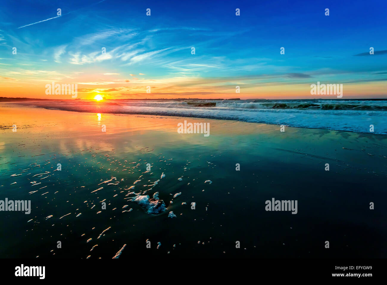 Beautiful orange sunset at the beach Stock Photo - Alamy